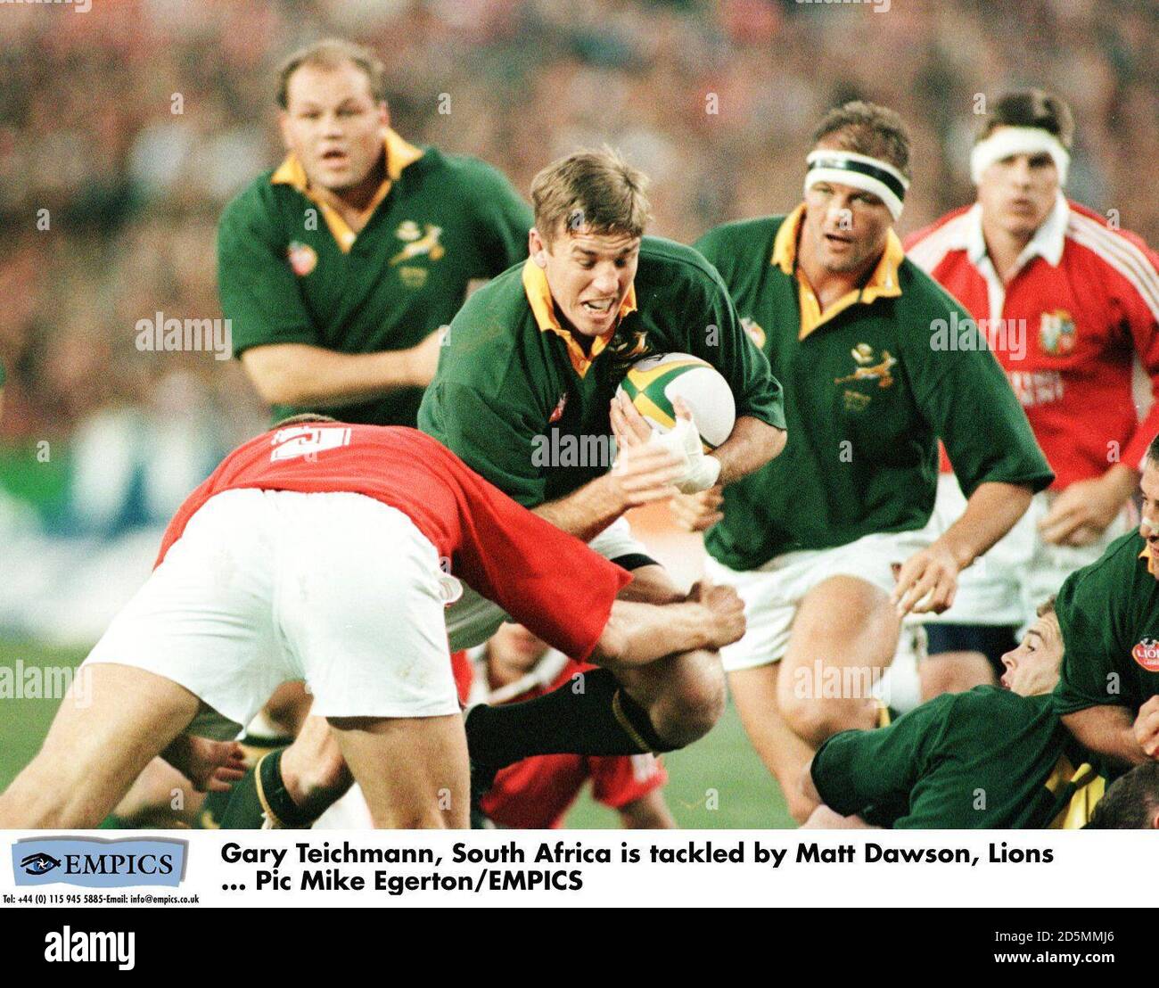 Gary Teichmann, South Africa is tackled by Matt Dawson, Lions Stock ...