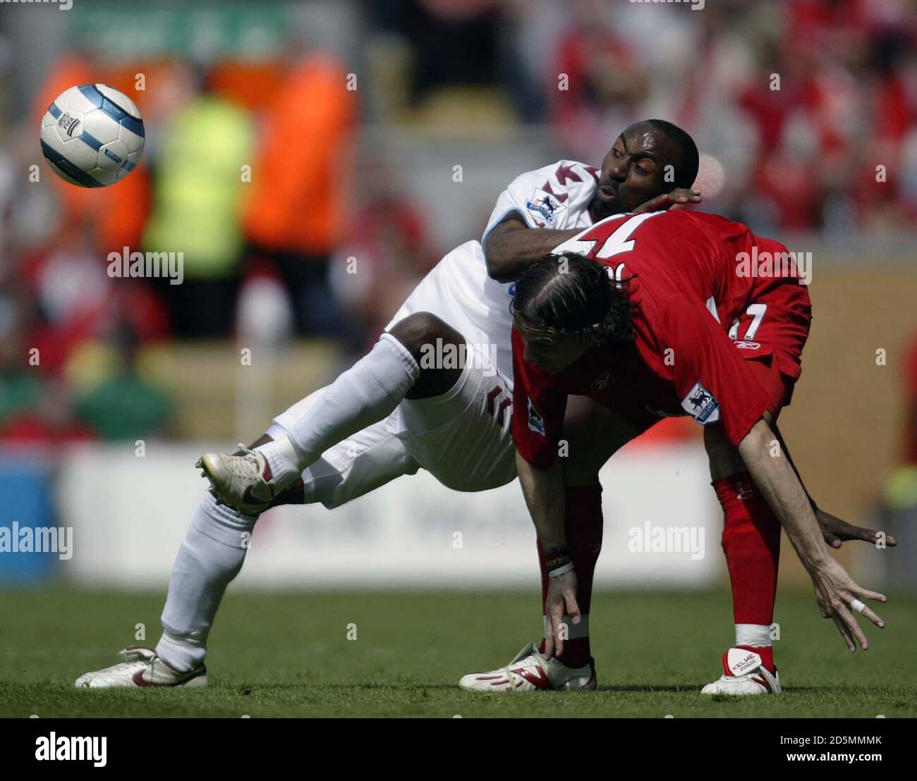 Liverpool's Josemi and Aston Villa's Darius Vassell battle for the ball ...