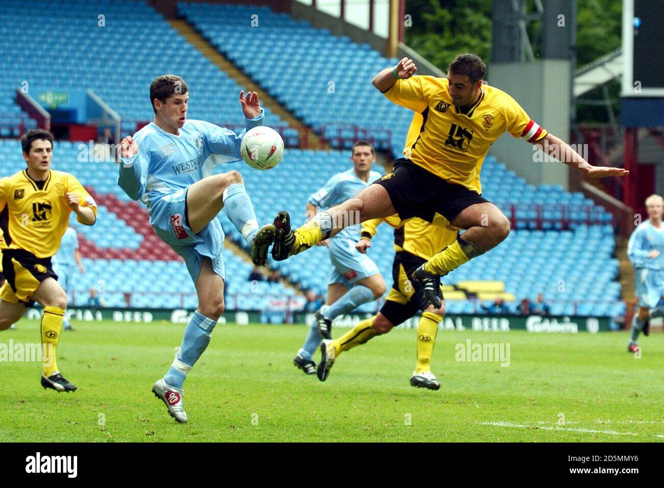 Hucknall Town's captain Chris Timons tackles Grays Athletic's Gary ...