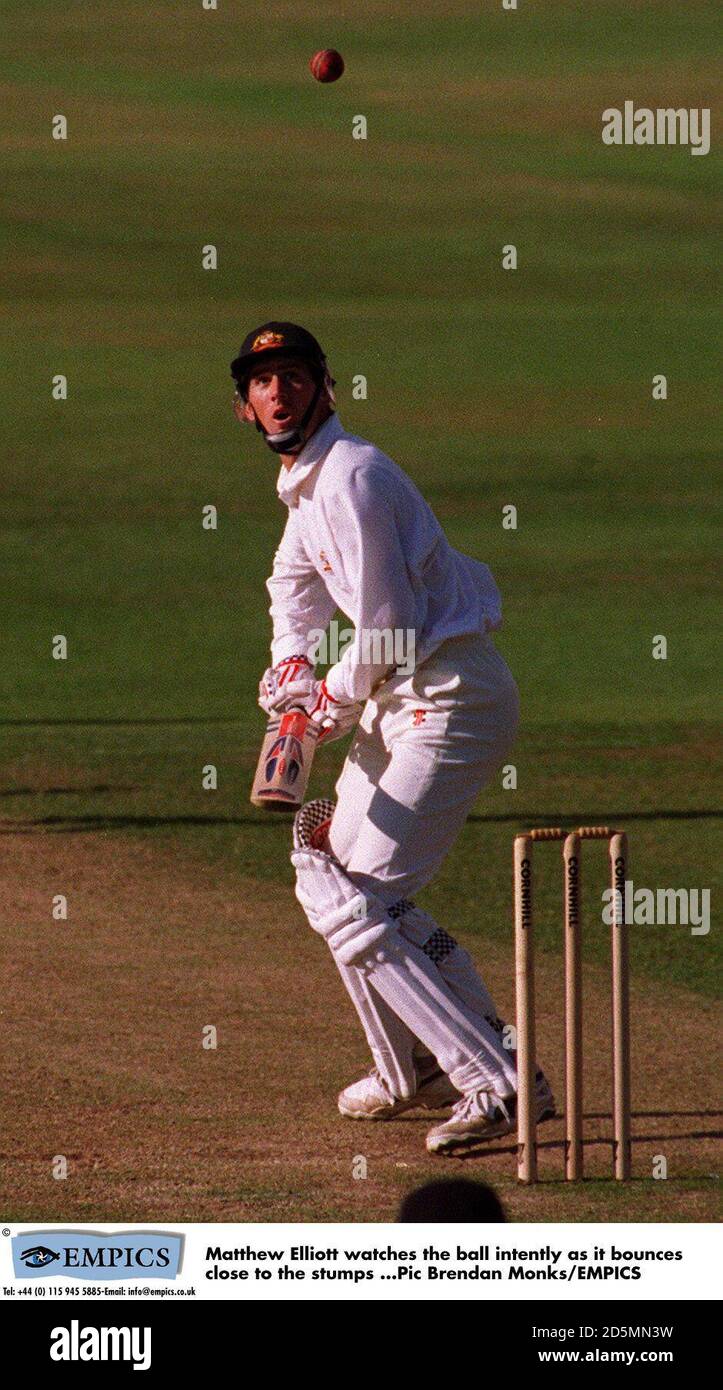 Matthew Elliott watches the ball intently as it bounces close to the ...