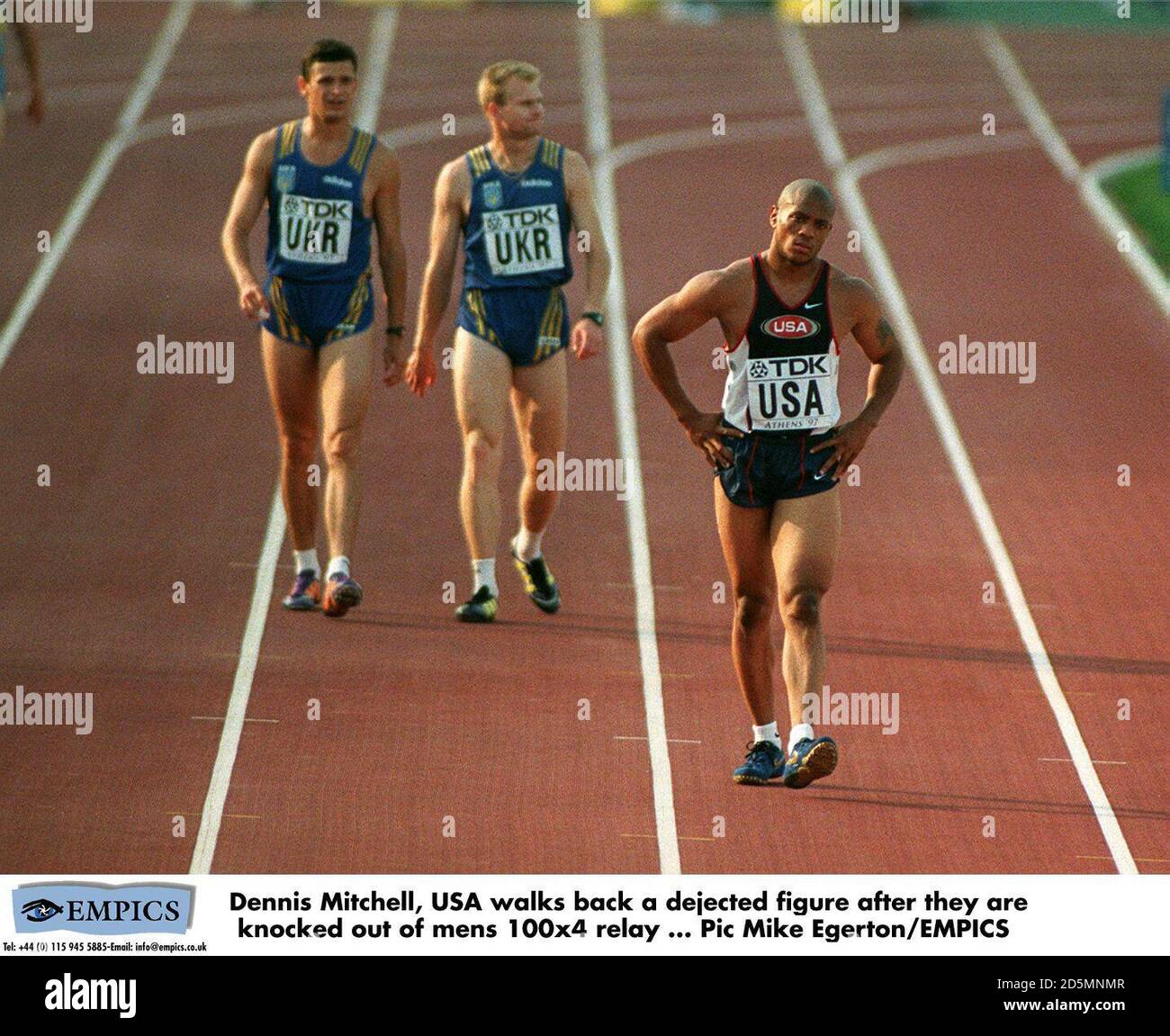 Dennis Mitchell, USA walks back a dejected figure after they are ...