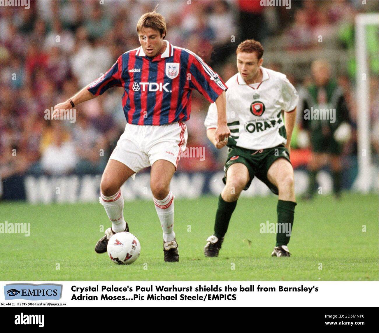 Crystal Palace's Paul Warhurst shields the ball from Barnsley's Adrian ...