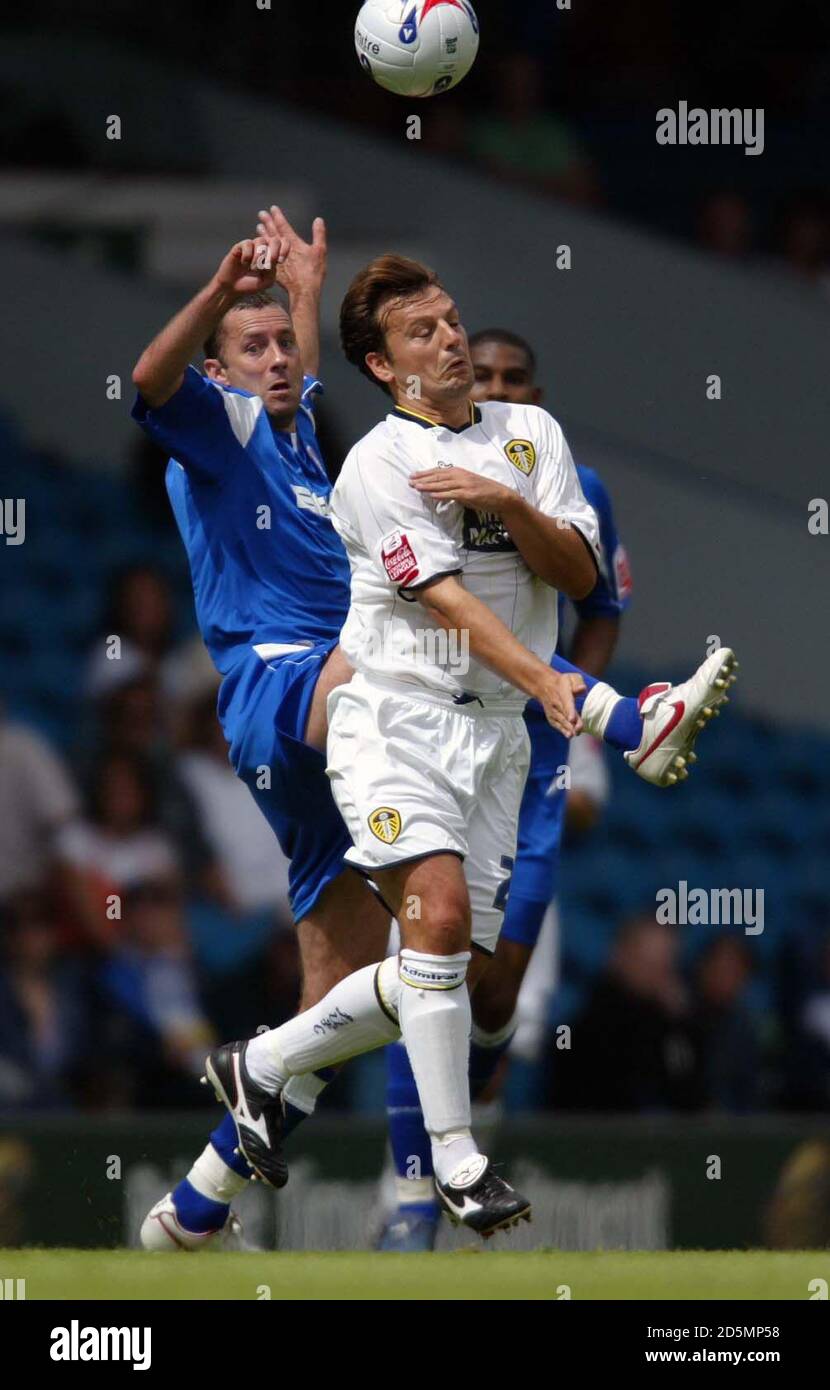 Leeds United's Robbie Blake and Millwall's Don Hutchinson battle for ...