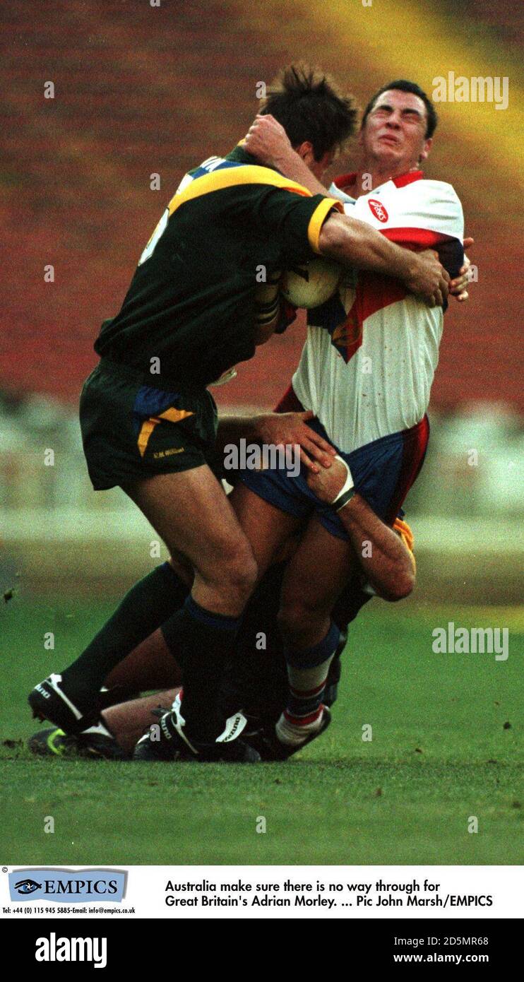 Great Britain's Adrian Morley (right) is tackle by two Australians ...