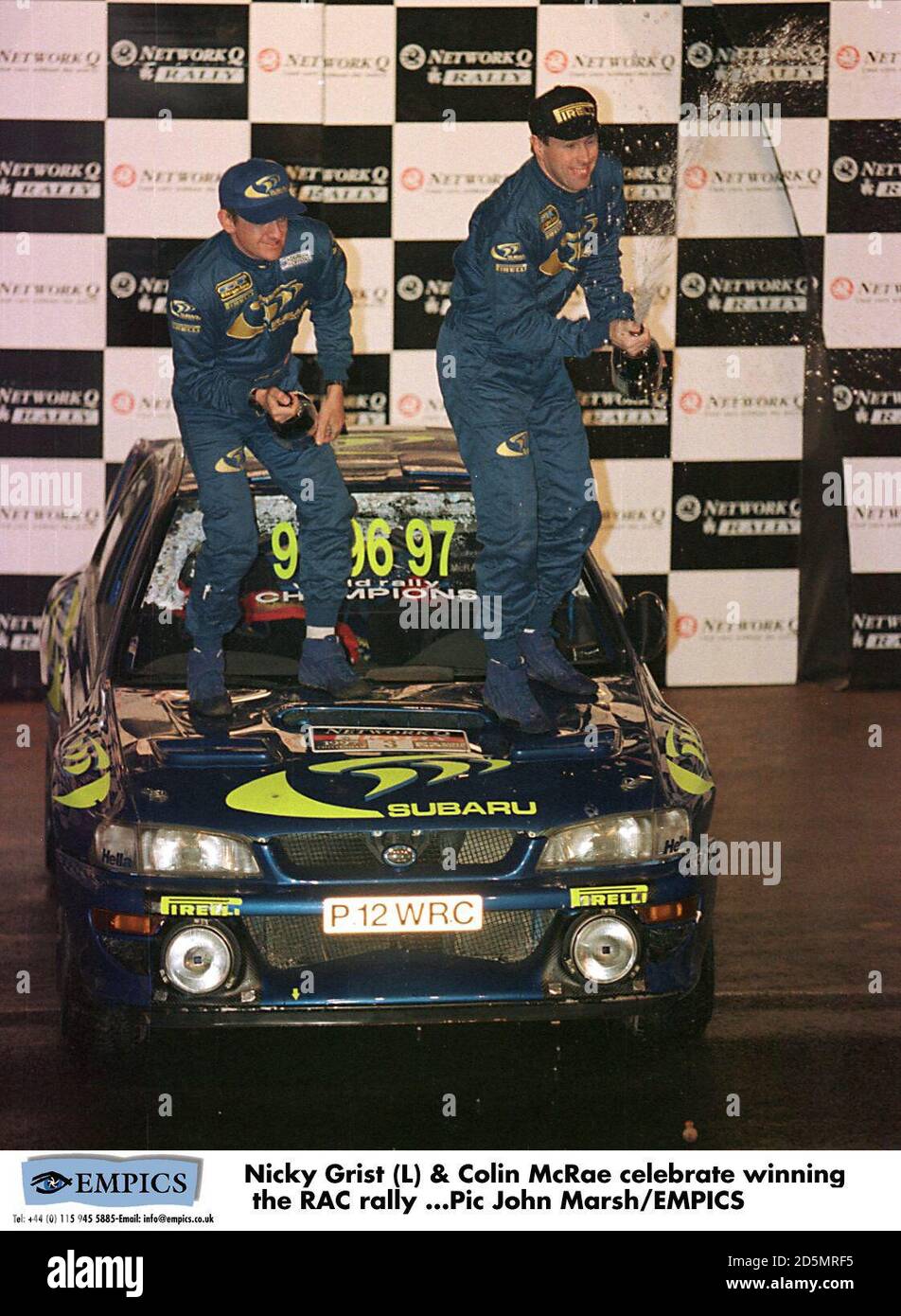 Nicky Grist (left) and Colin McRae (right) spray champagne to celebrate ...