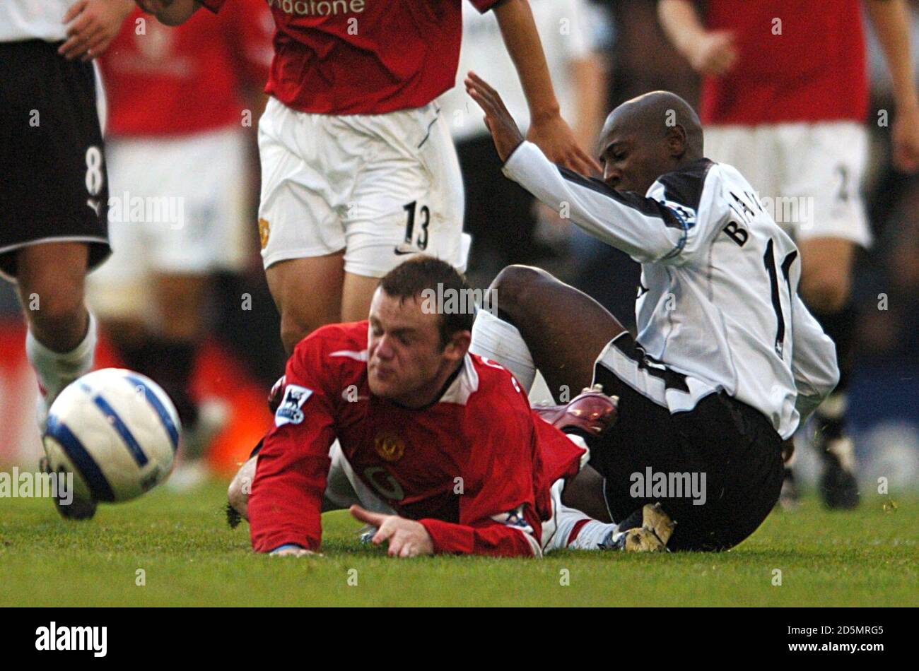 Manchester United's Wayne Rooney is fouled by Fulham's Luis Boa Morte ...