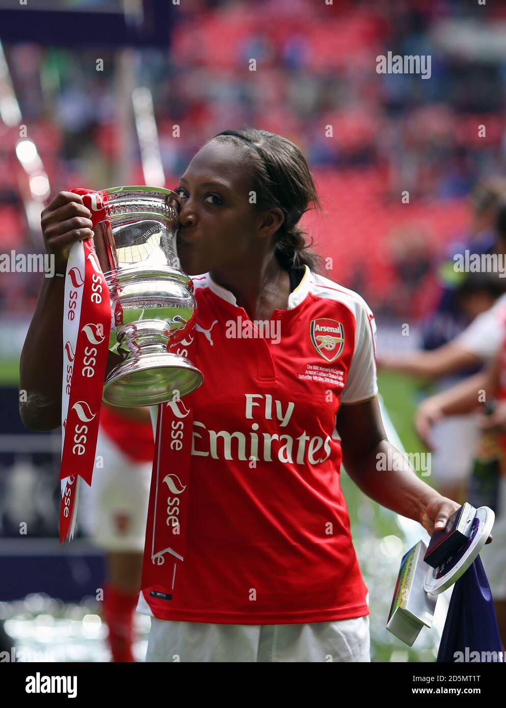Arsenal's Danielle Carter celebrates with the SSE Women' FA Cup trophy ...