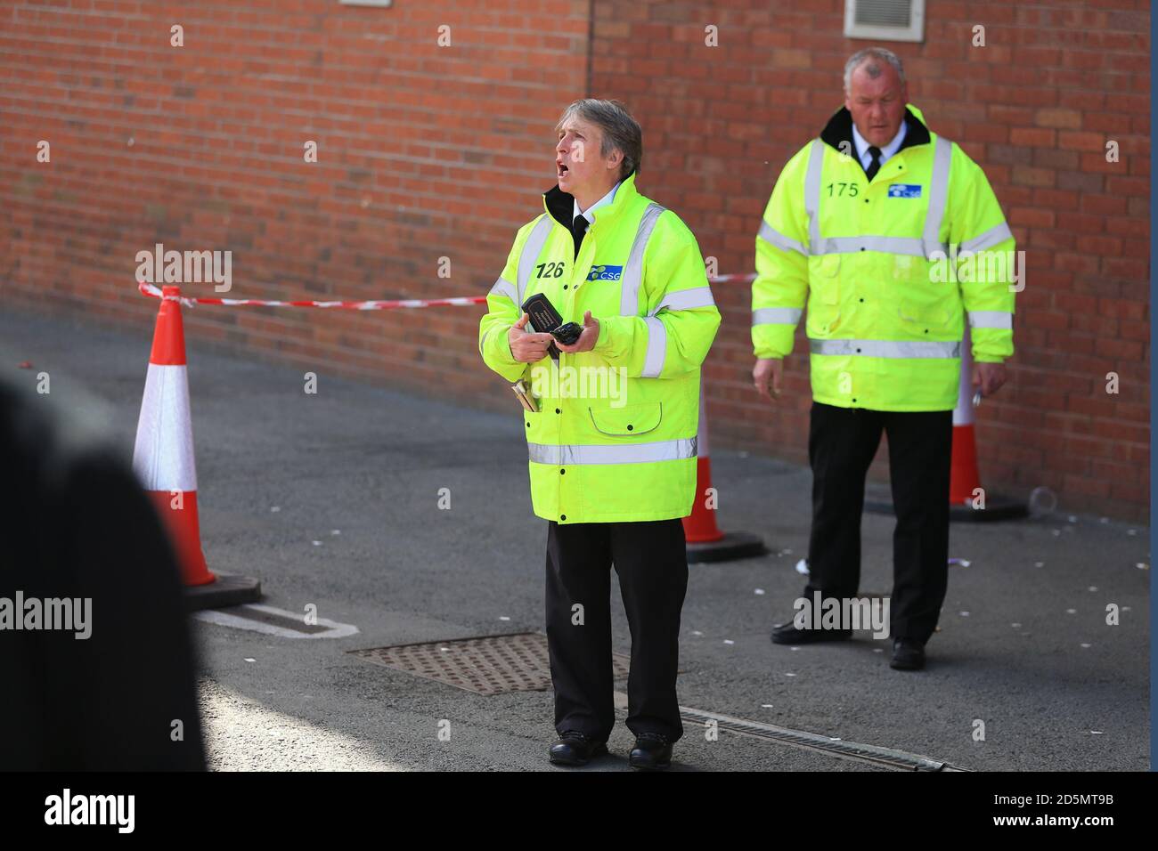 Stewards outside Old Trafford following a security evacuation Stock ...