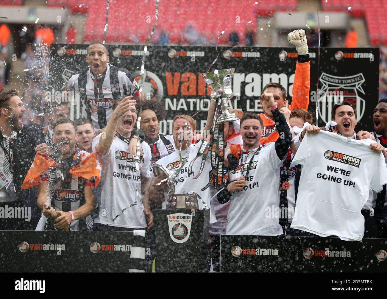Grimsby Town's Craig Disley lifts the trophy after his team win Stock ...