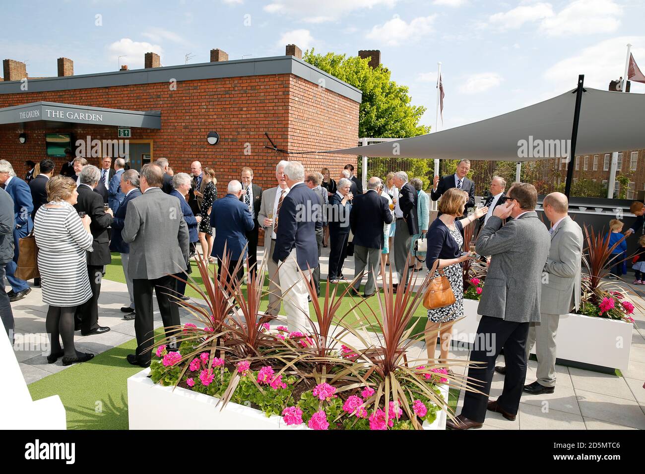 Guests on the terrace garden of the Peter May Stand Stock Photo - Alamy