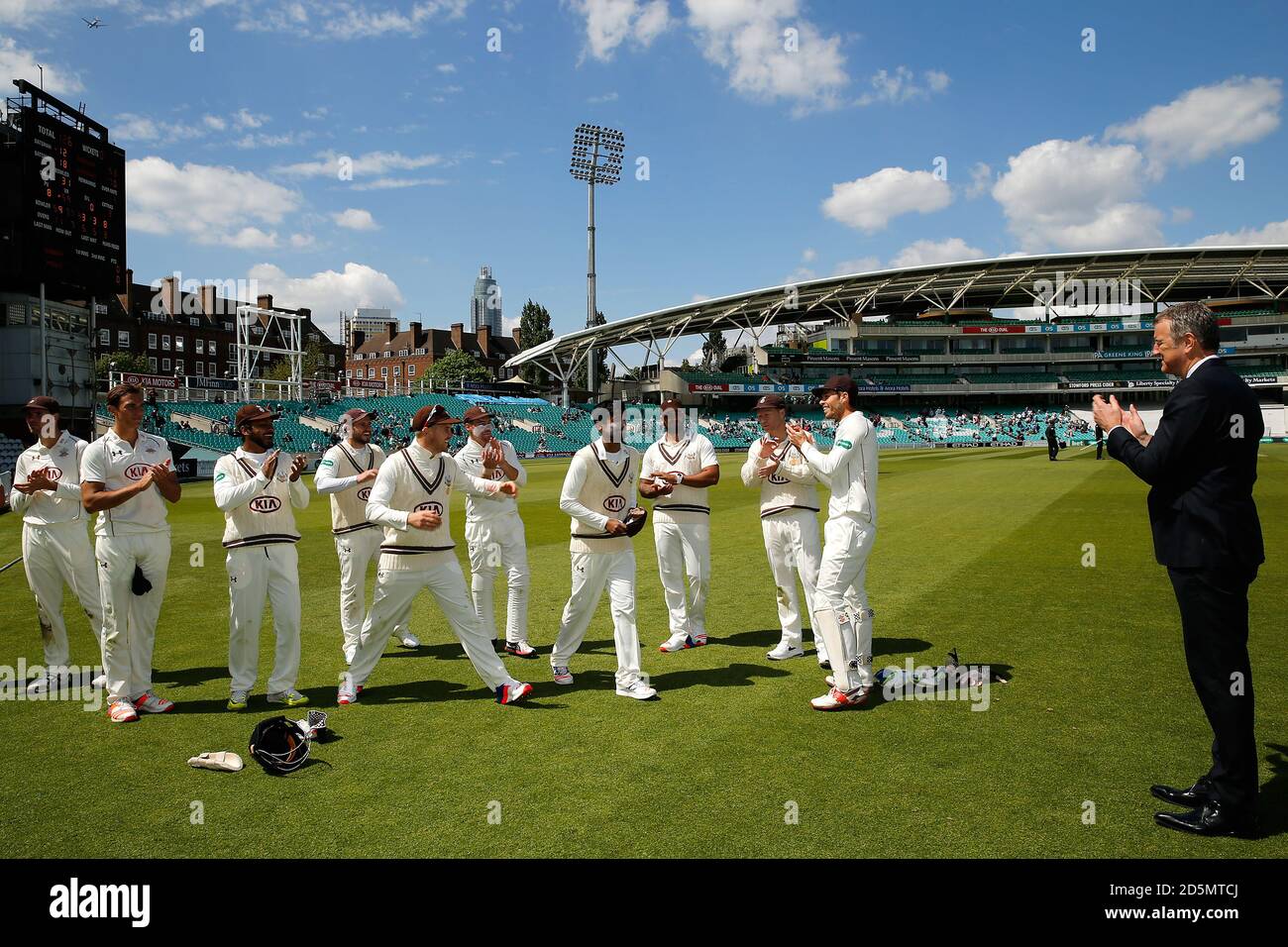 Surrey players applaud Arun Harinath as he is awarded his first XI Cap ...