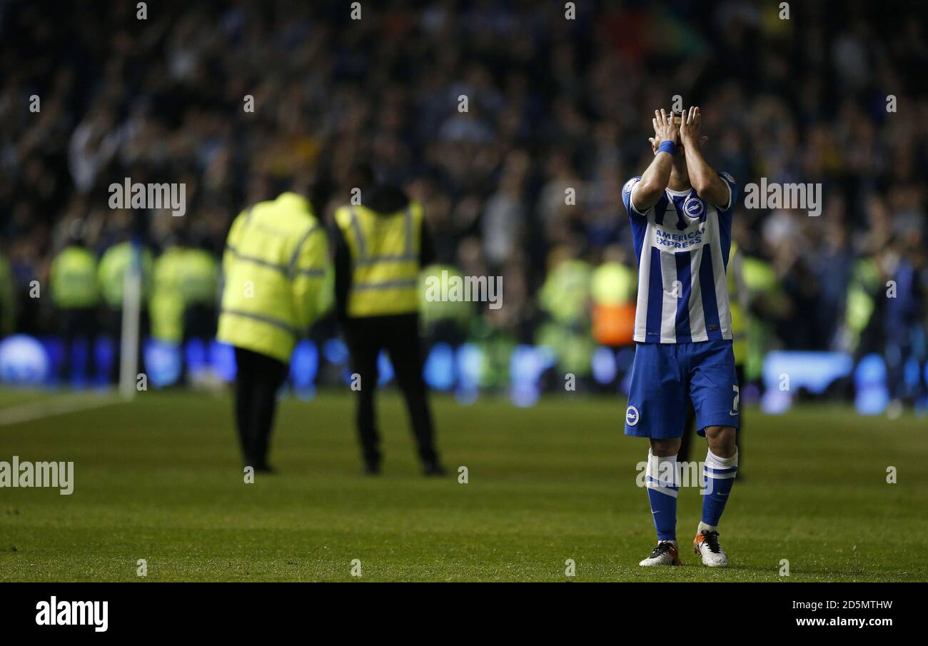 Brighton and Hove Albion's Beram Kayal looks dejected at full time ...