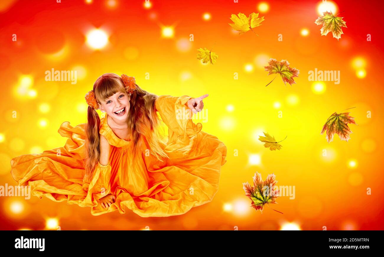 Kids playing with leaves in fall. Autumn leaves background with girl ...