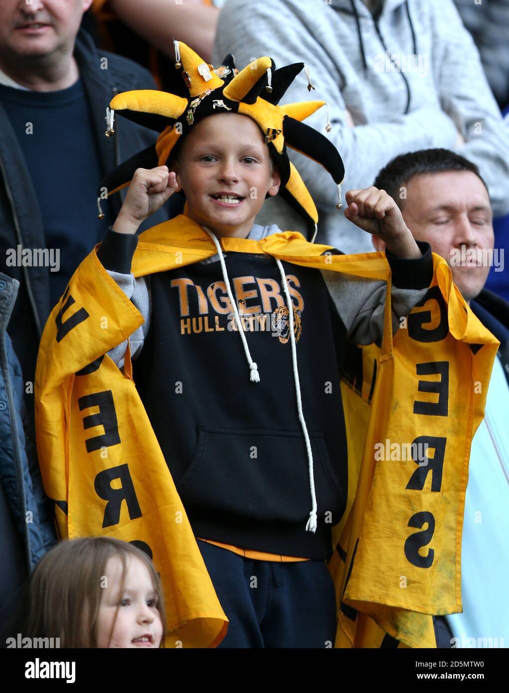 A young Hull City fan cheers on his side in the stands Stock Photo - Alamy