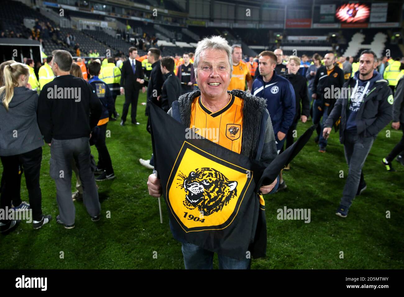 Hull City fans invade the pitch as they celebrate making it to the Play ...