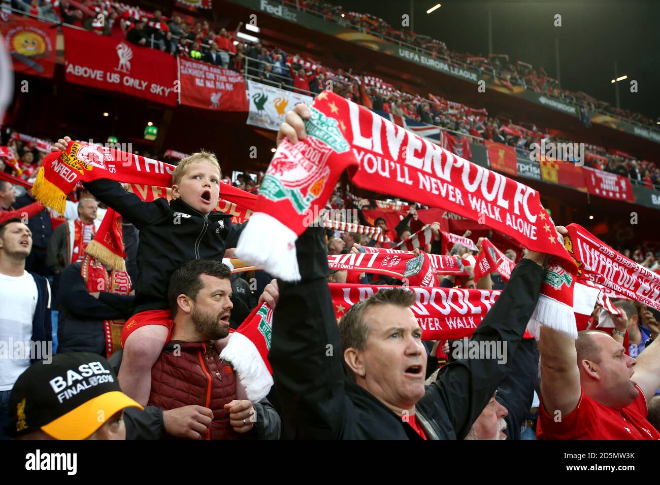 Liverpool fans cheer on their side in the stands Stock Photo - Alamy