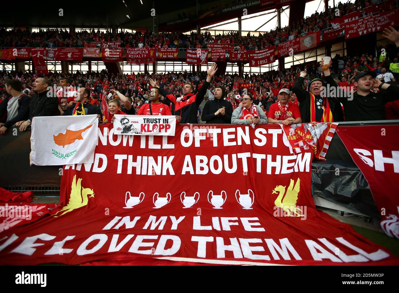 Liverpool fans cheer on their side in the stands Stock Photo - Alamy