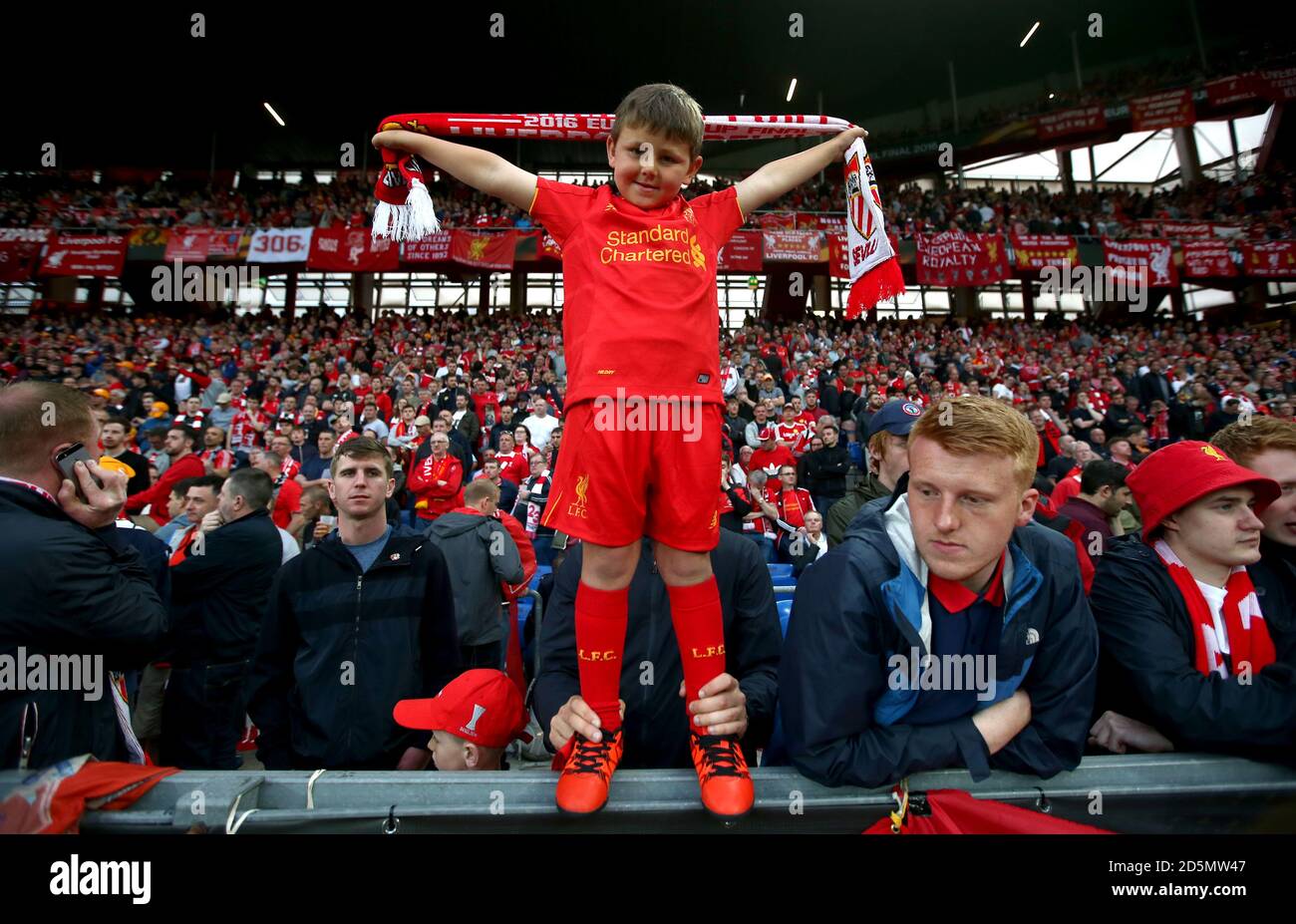 Liverpool fans cheer on their side in the stands Stock Photo - Alamy