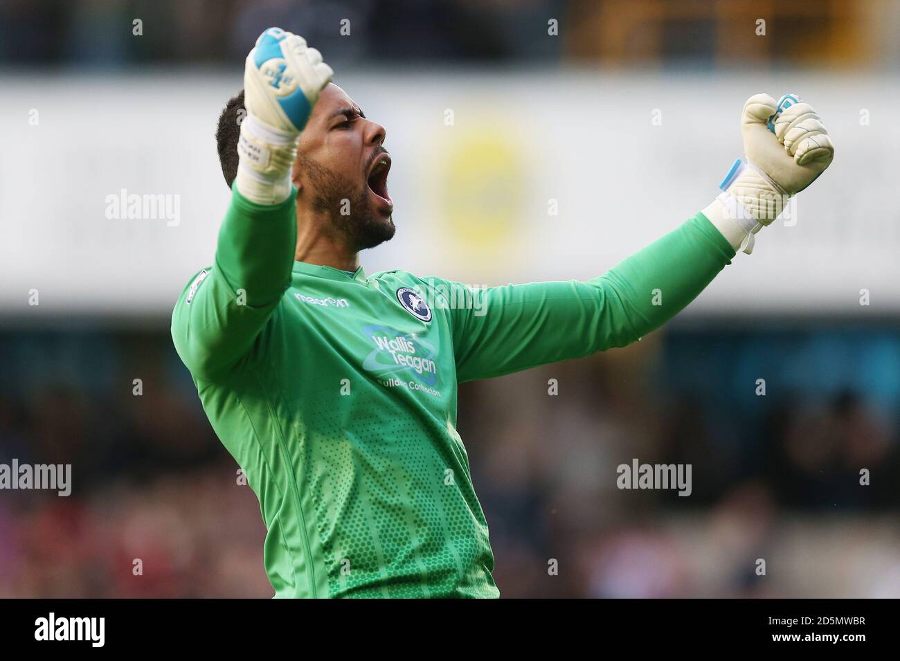 Millwall goalkeeper Jordan Archer celebrates after their first goal is ...