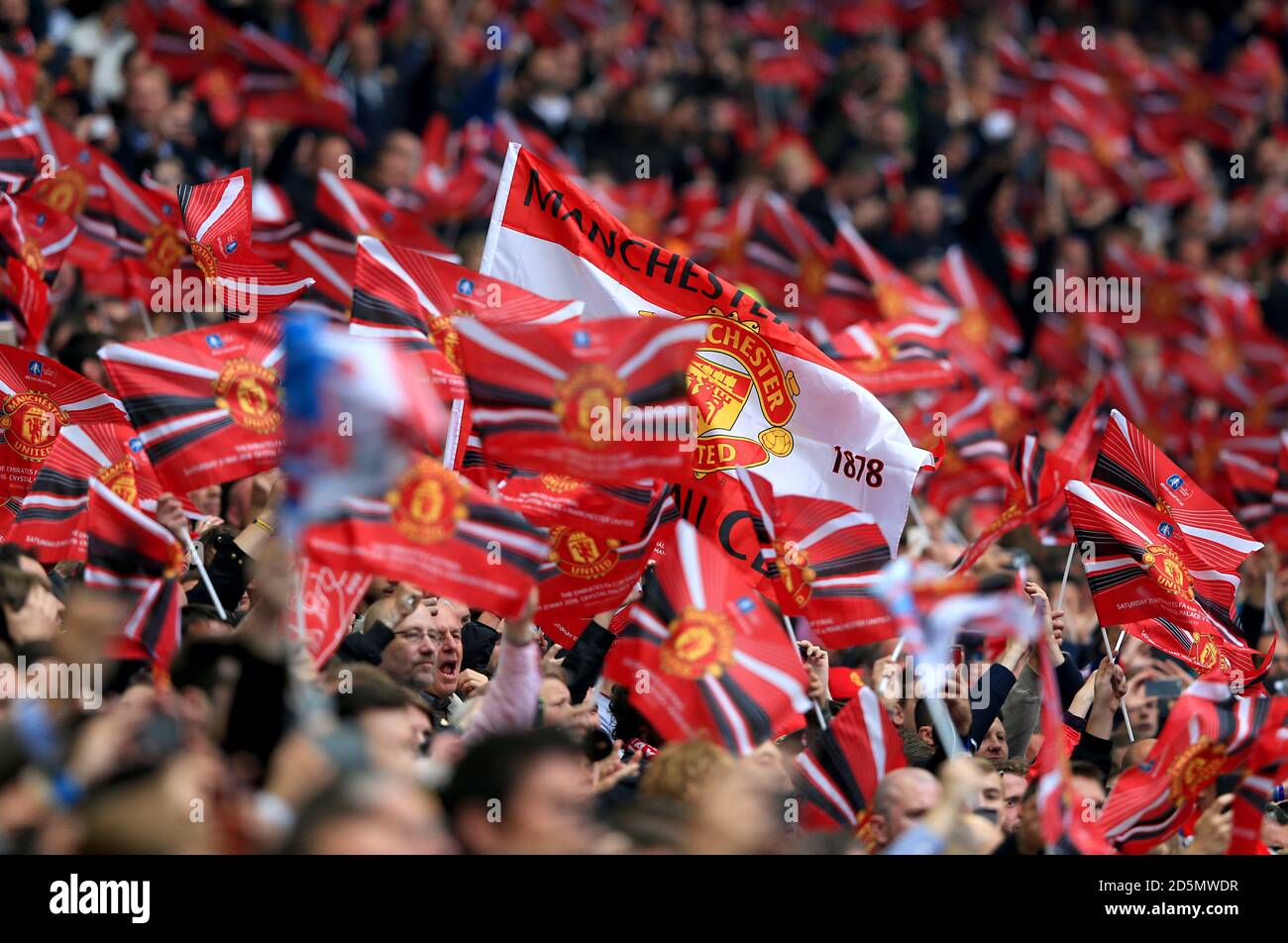 Manchester United fans waving flags in the stands Stock Photo - Alamy