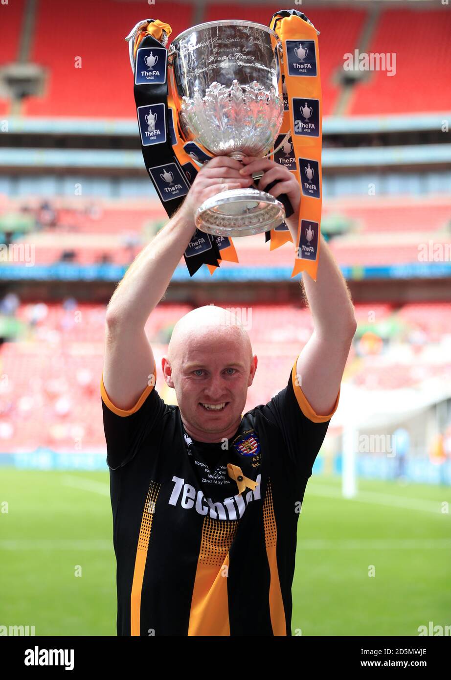 Morpeth Town's Captain Keith Graydon with the trophy Stock Photo - Alamy