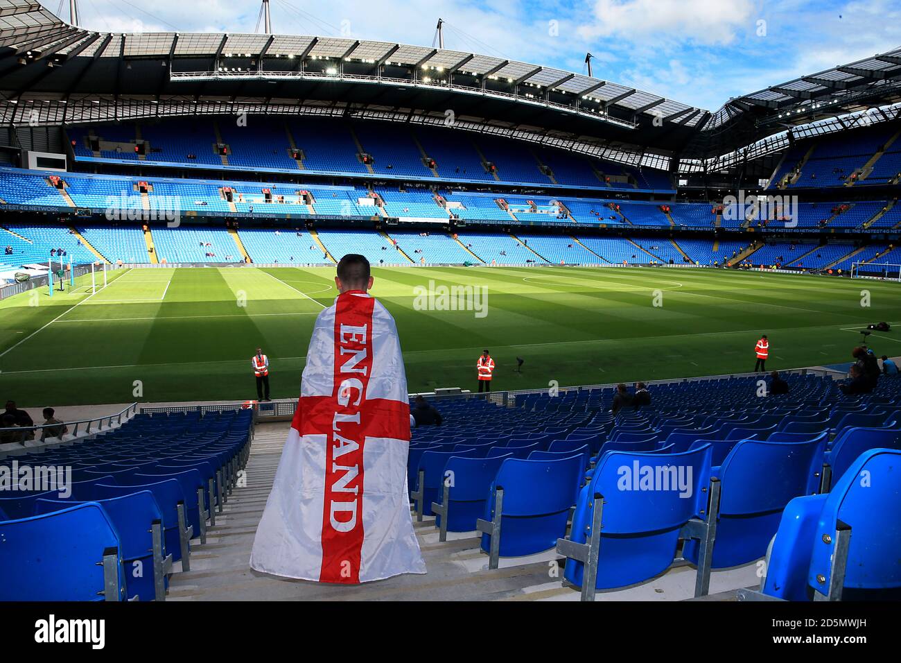 An England fan wearing a flag in the stands prior to the match Stock ...