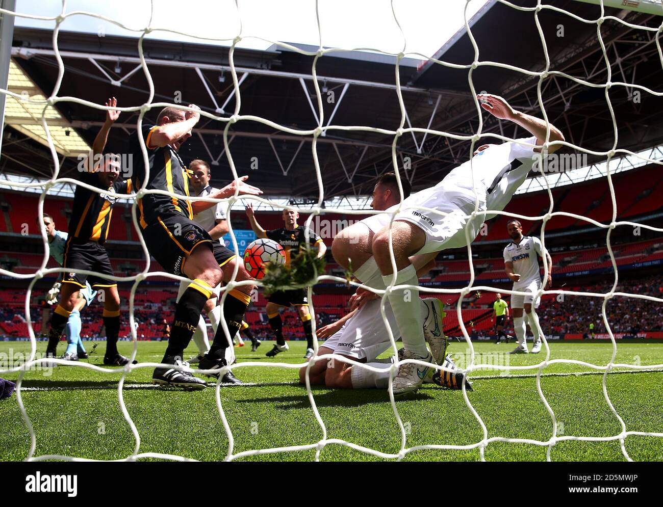 Morpeth Town's Chris Swailes (left) bundles in their first goal Stock ...