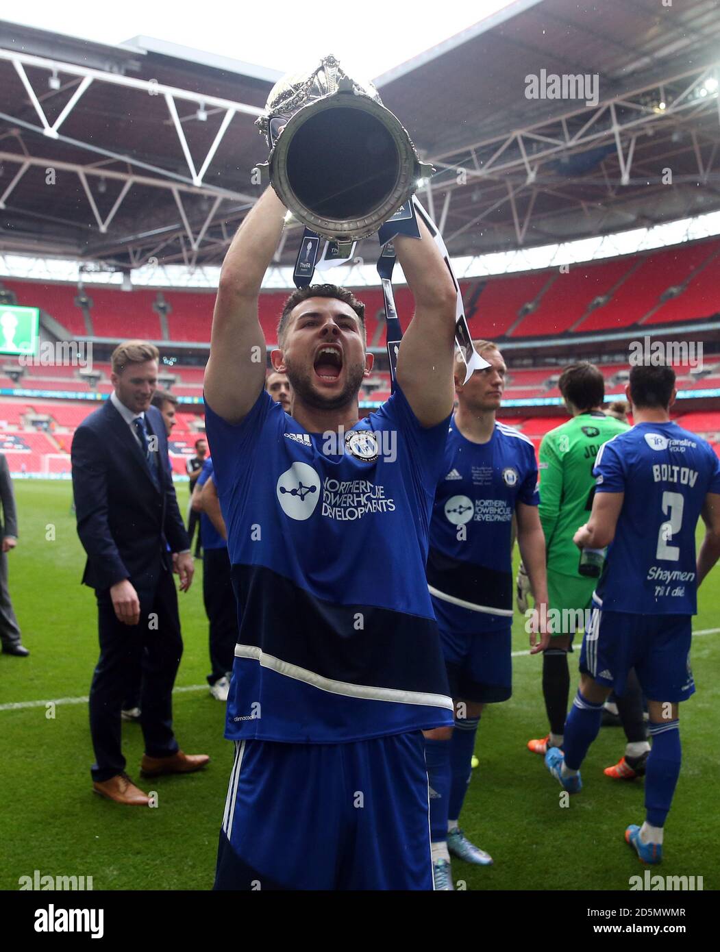 Halifax Town's Connor Hughes lifts the trophy after the game Stock ...