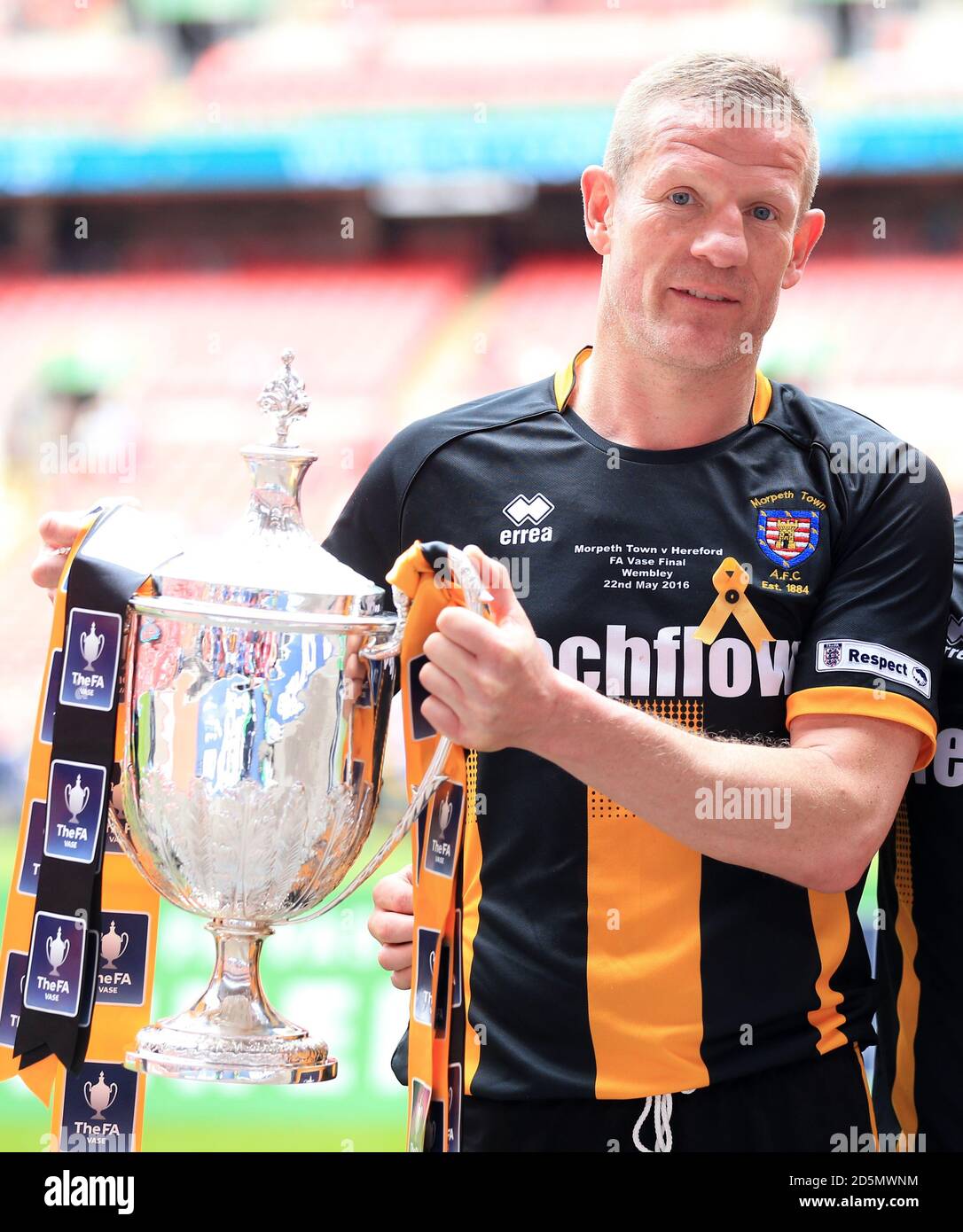 Morpeth Town's Chris Swailes with the trophy Stock Photo - Alamy