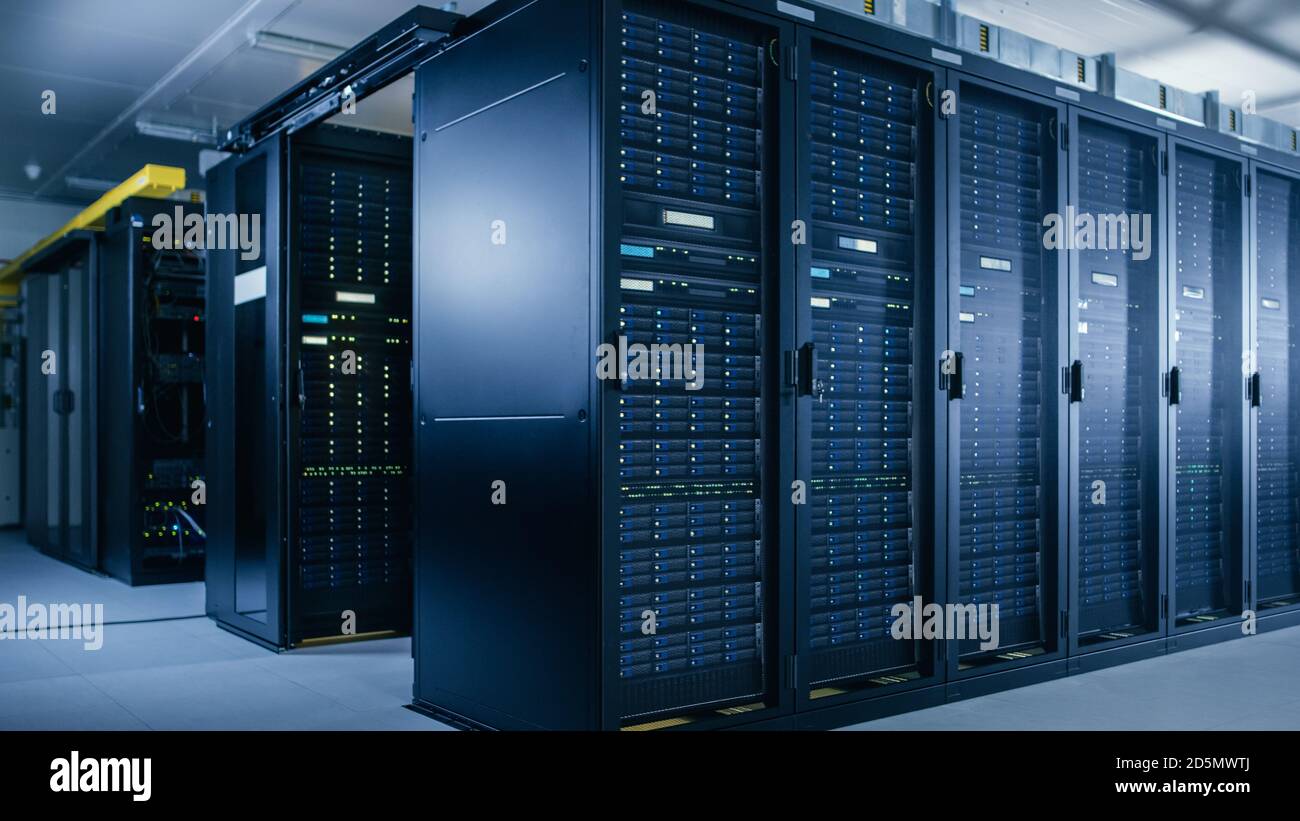 Shot of Data Center With Multiple Rows of Fully Operational Server Racks. Modern ...