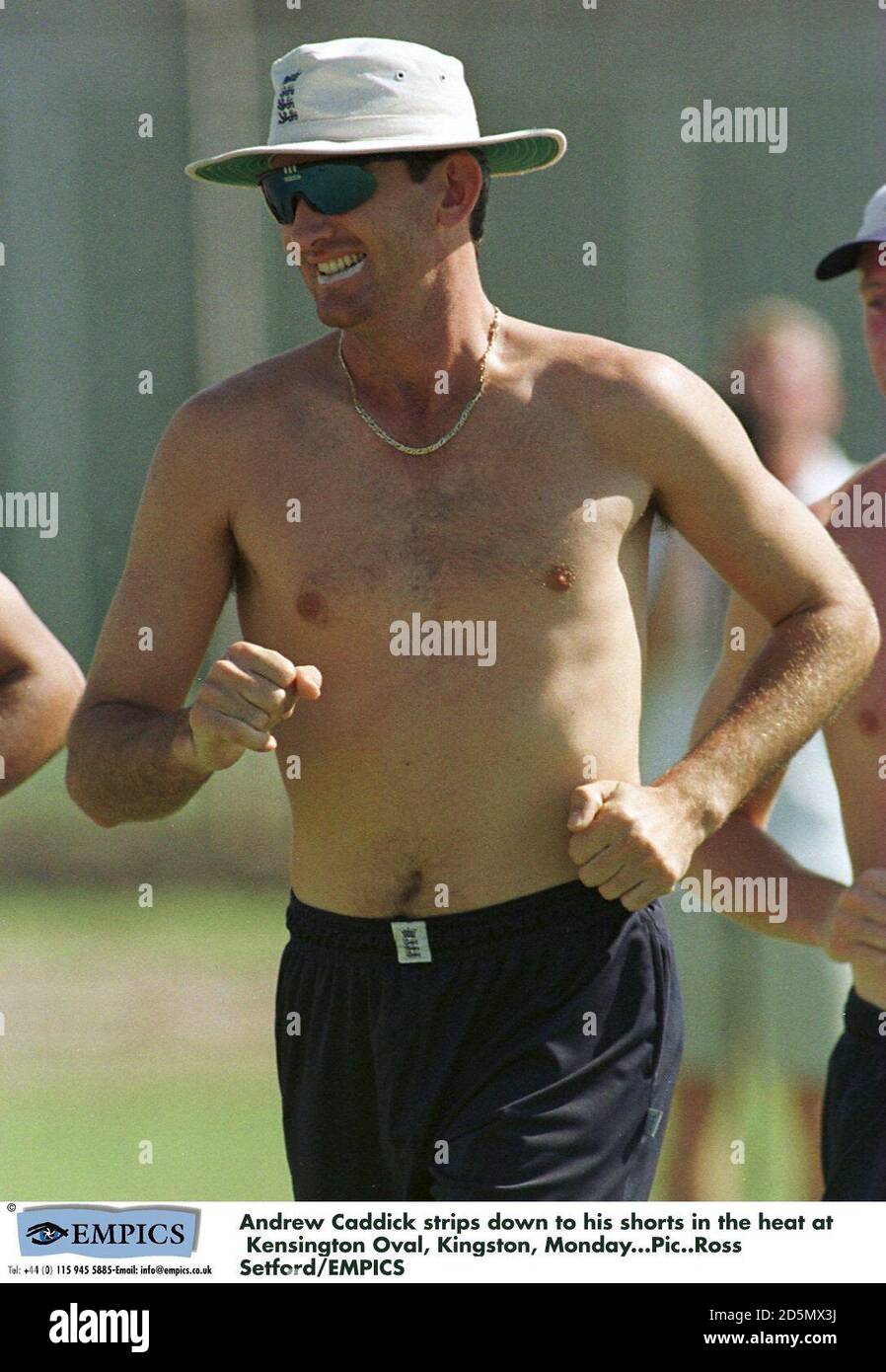Andrew Caddick strips down to his shorts in the heat at Kensington Oval ...