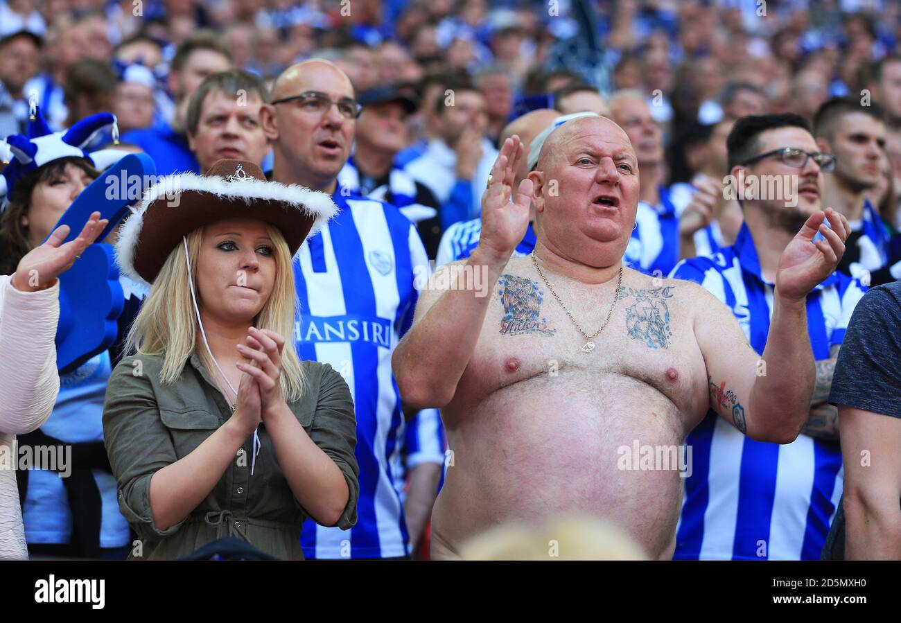 Sheffield Wednesday fans look dejected in the stands after their side ...