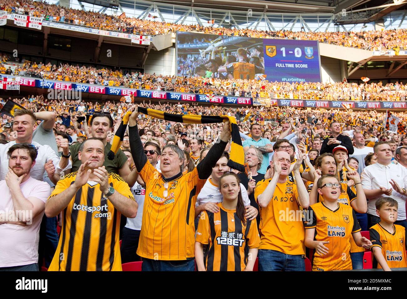 Hull City fans celebrate in the stands Stock Photo - Alamy