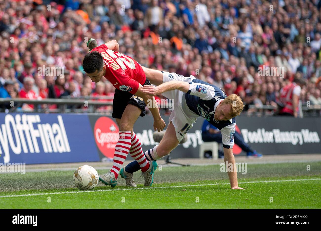 Barnsley's George Williams (left) and Millwall's Chris Taylor battle ...