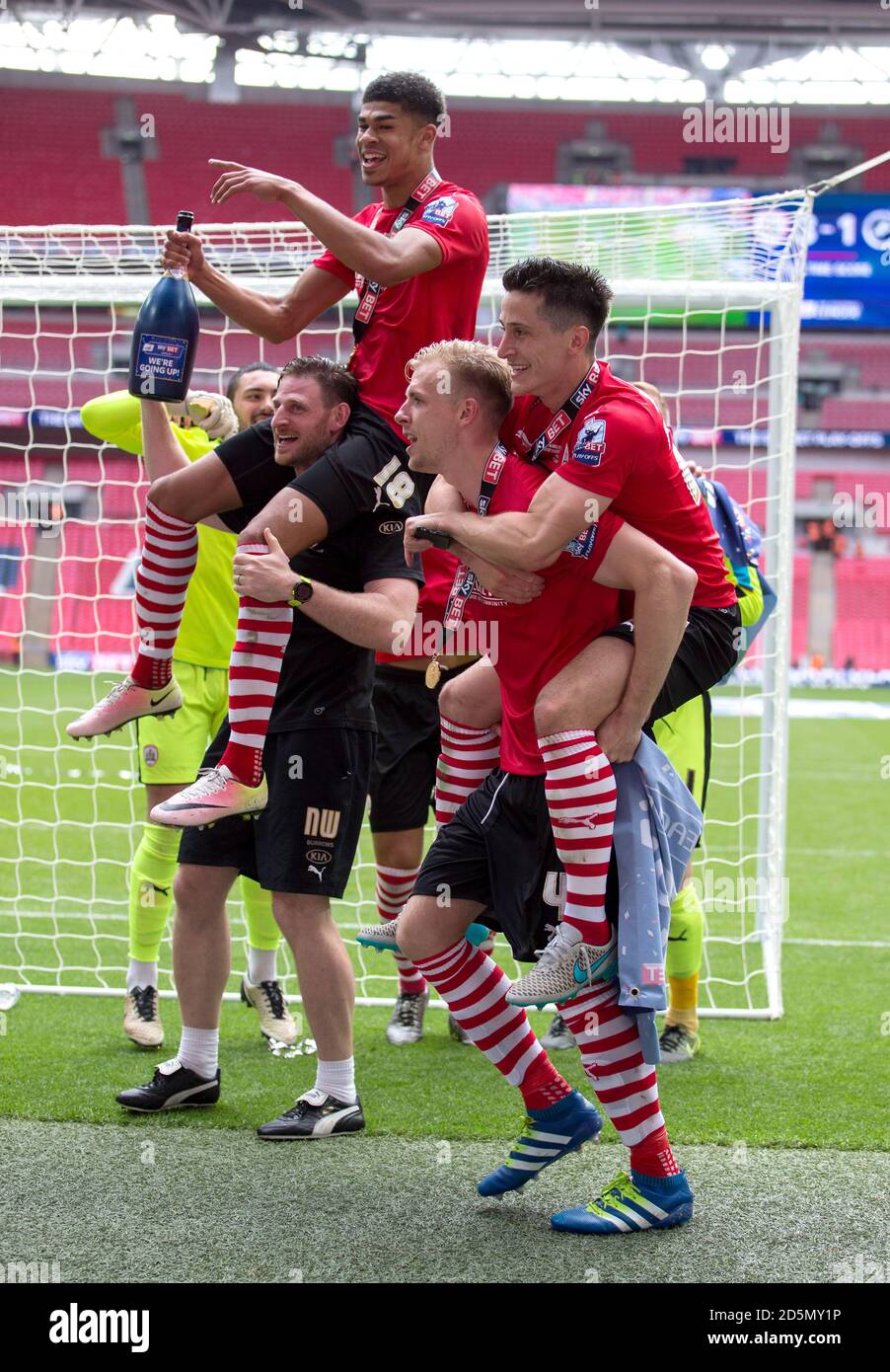 Barnsley's Ashley Fletcher celebrates on the shoulders of Head of ...