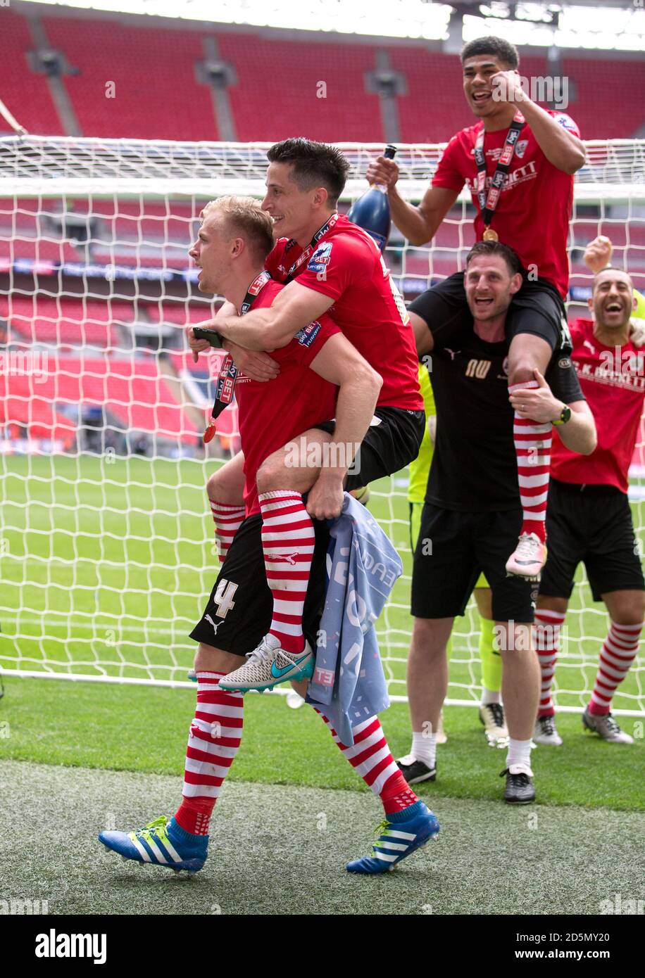 Barnsley's Ashley Fletcher celebrates on the shoulders of Head of ...