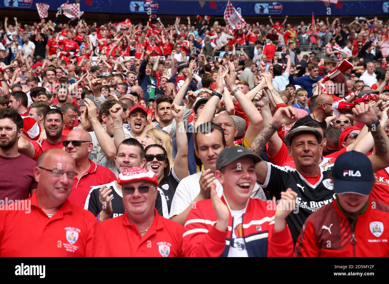 Barnsley fans celebrate victory in the stands Stock Photo - Alamy