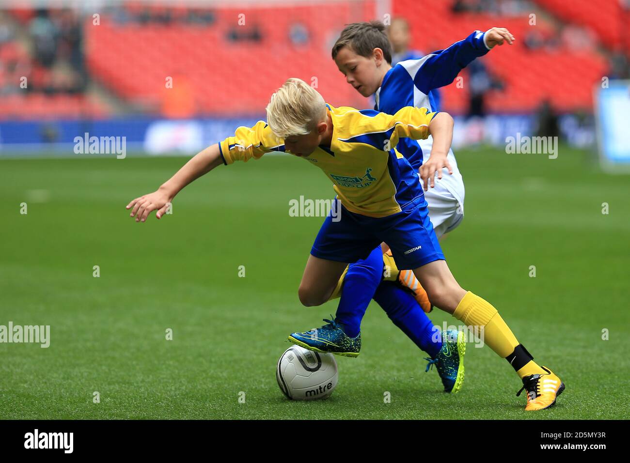 Kids compete in the + Sport Football League Kids Cup Final Stock Photo ...