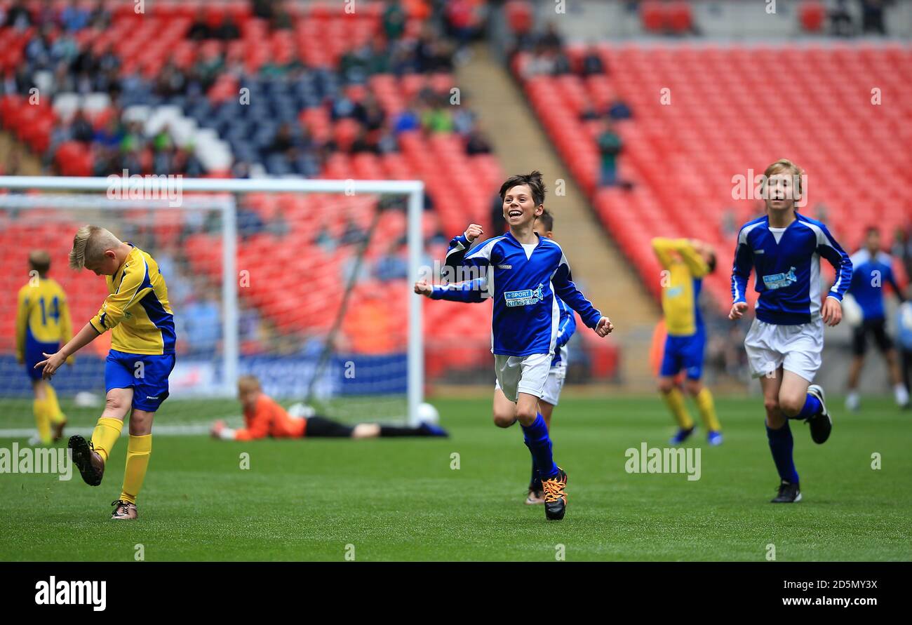 Kids compete in the + Sport Football League Kids Cup Final Stock Photo ...