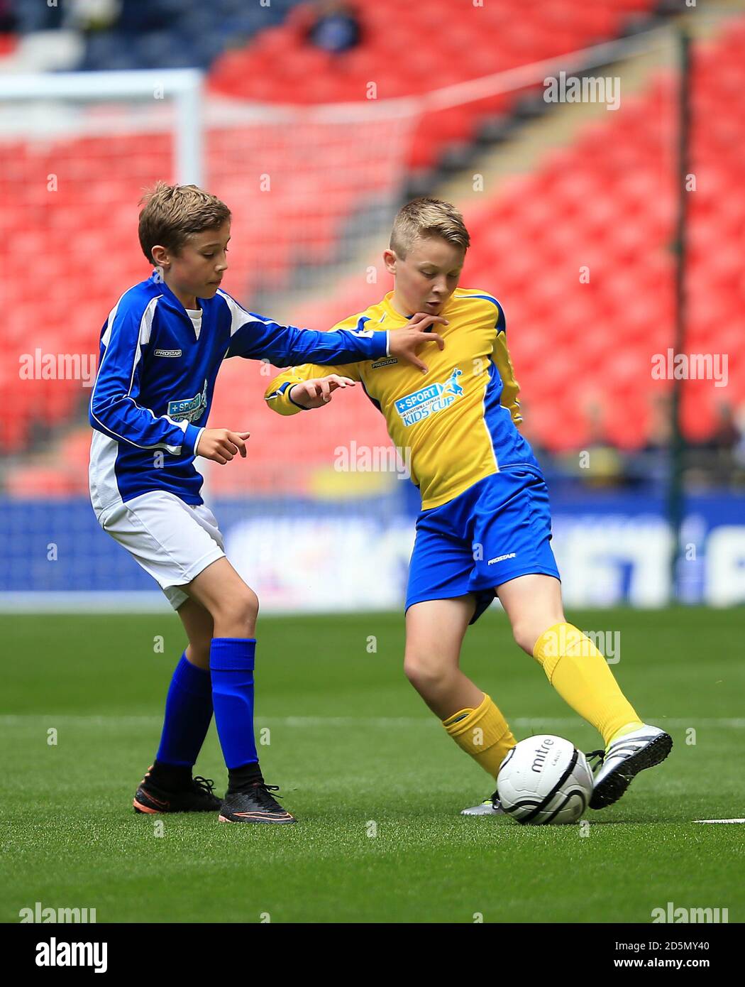 Kids compete in the + Sport Football League Kids Cup Final Stock Photo ...