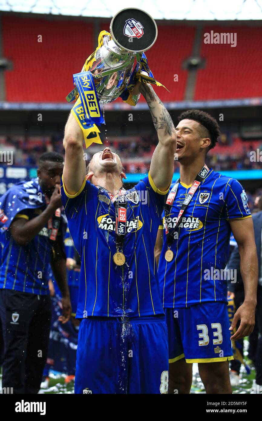 AFC Wimbledon's Jake Reeves celebrates with the League Two Play Off ...