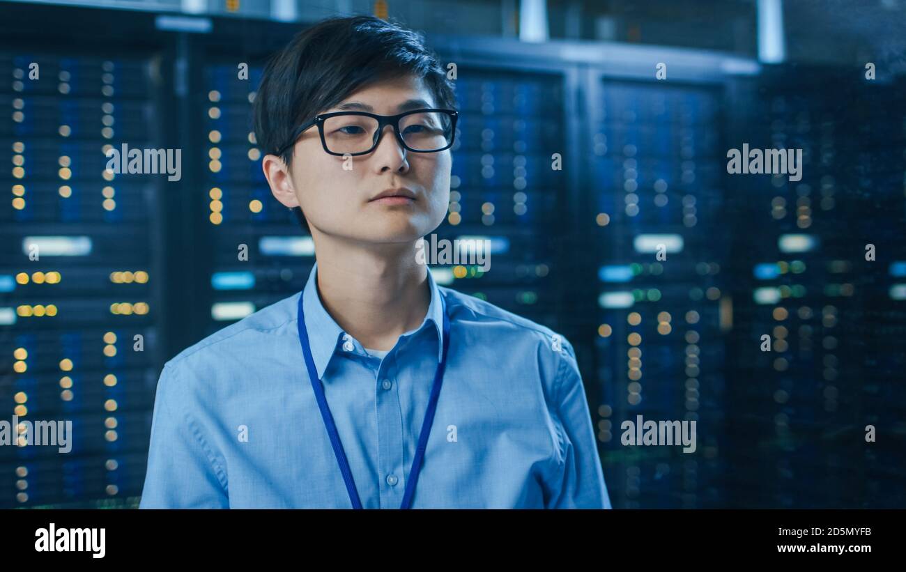 In the Modern Data Center: Portrait of IT Engineer Working With Touch ...