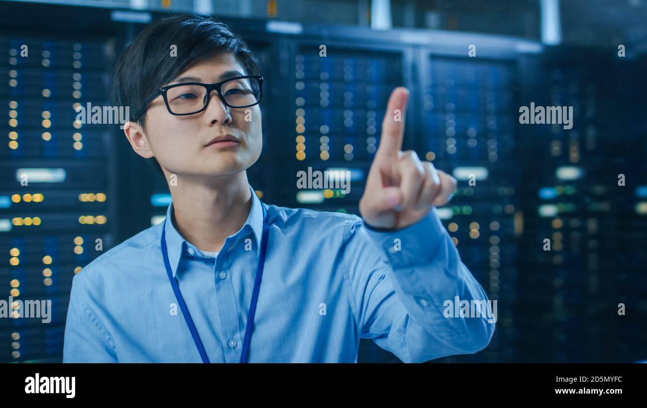 In the Modern Data Center: Portrait of IT Engineer Working With Touch ...