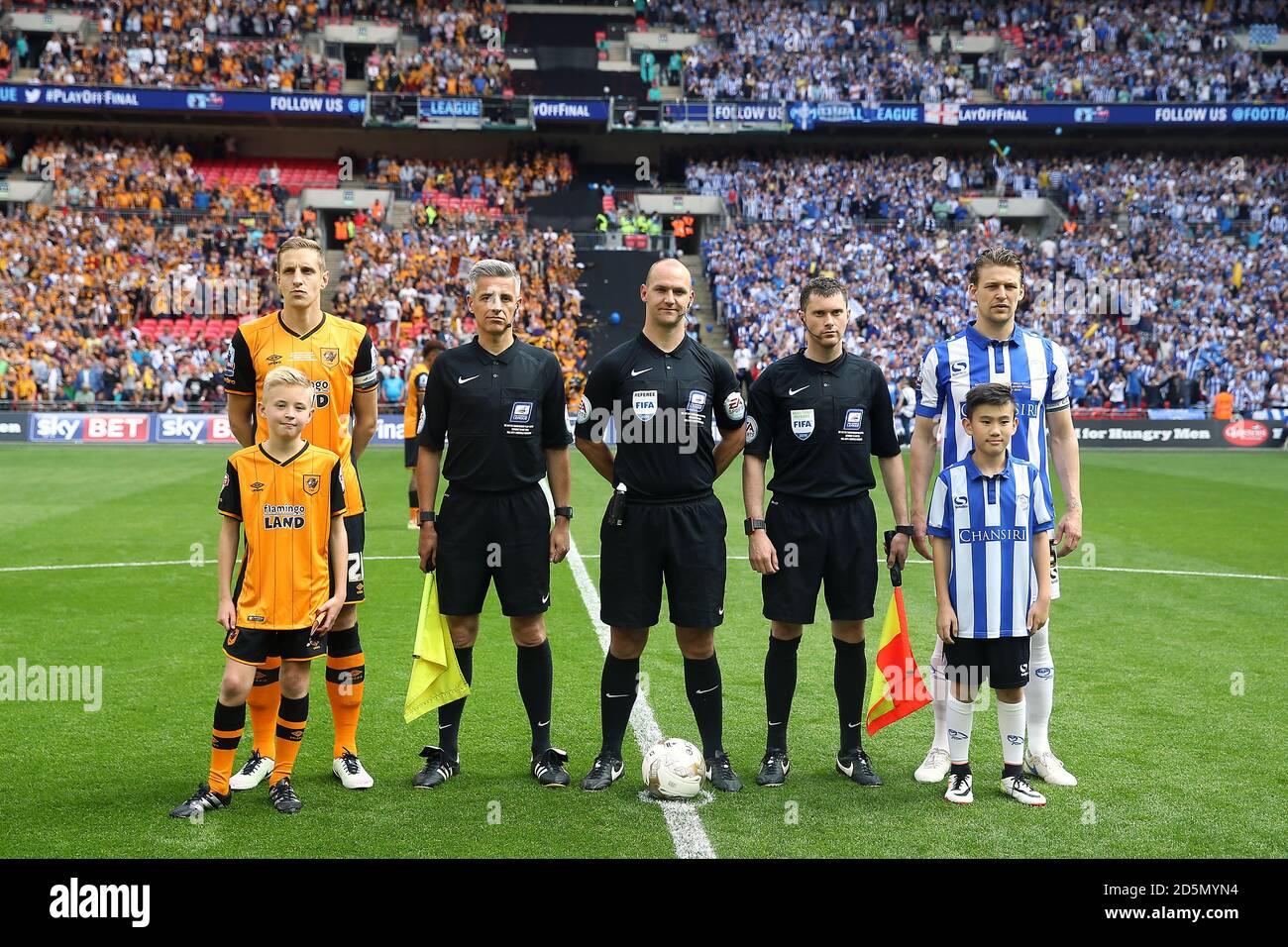L-R: Hull City captain Michael Dawson, assistant referee Peter Kirkup ...
