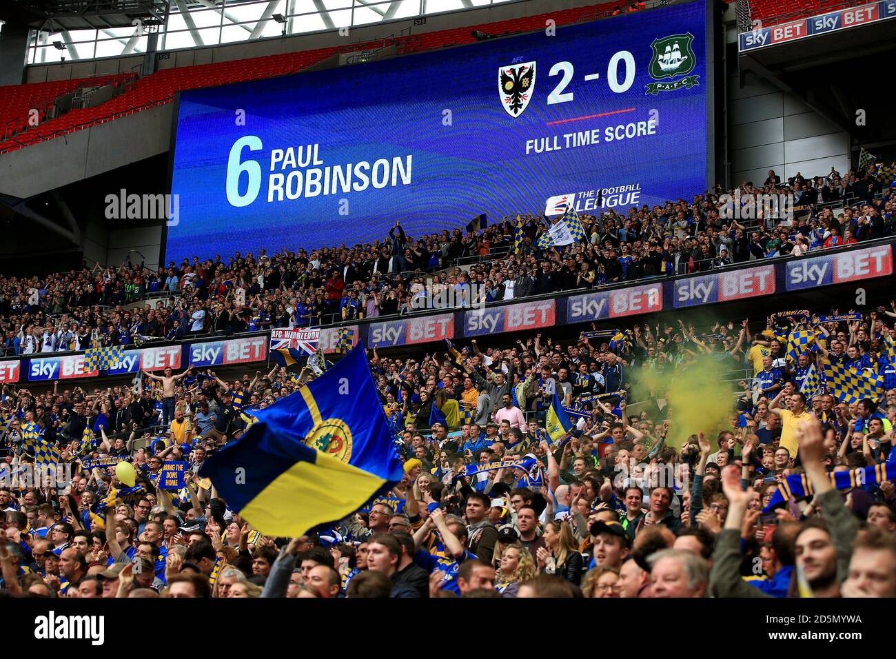 AFC Wimbledon fans show their support in the stands Stock Photo - Alamy