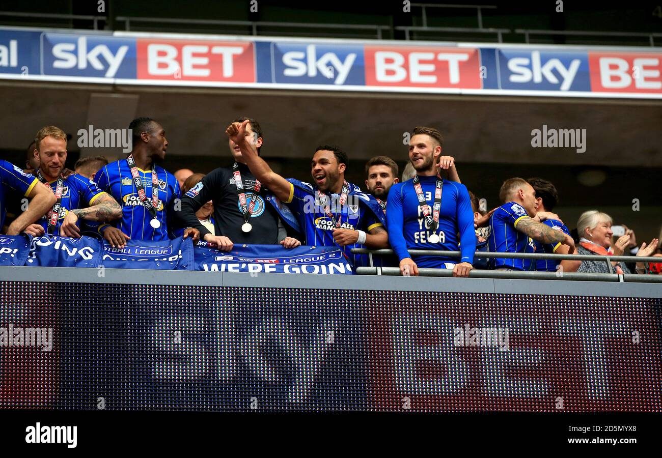 AFC Wimbledon players celebrate winning promotion to the Sky Bet League ...