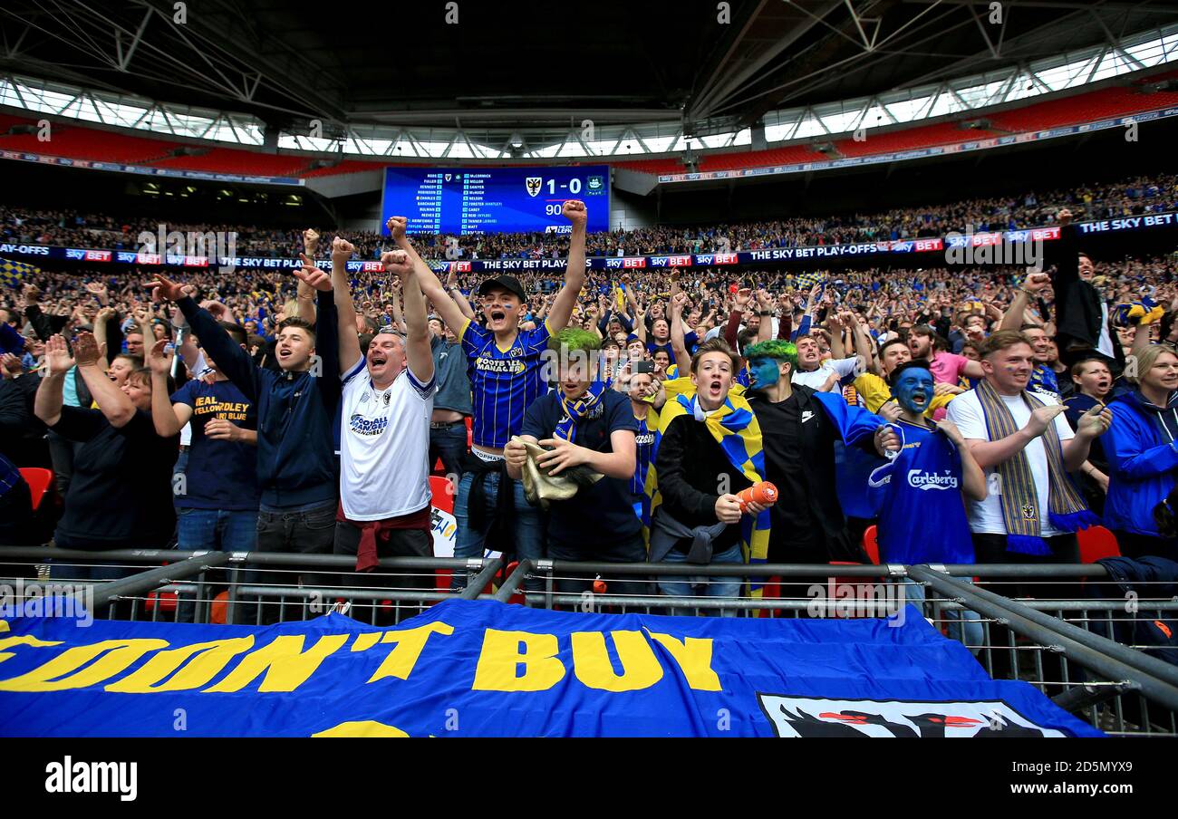 AFC Wimbledon fans show their support in the stands Stock Photo - Alamy