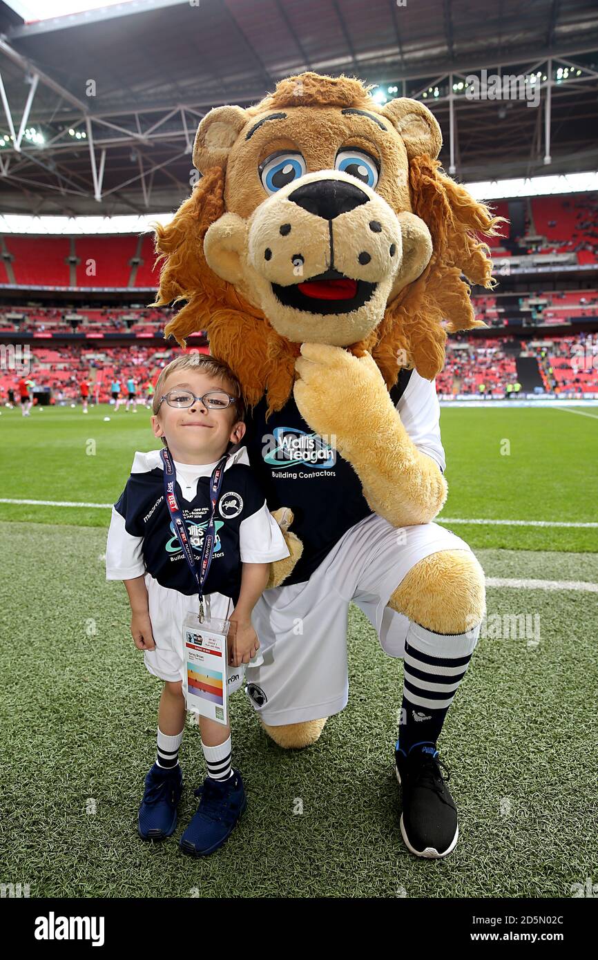 A yound mascot with Millwall mascot Zampa the Lion Stock Photo - Alamy