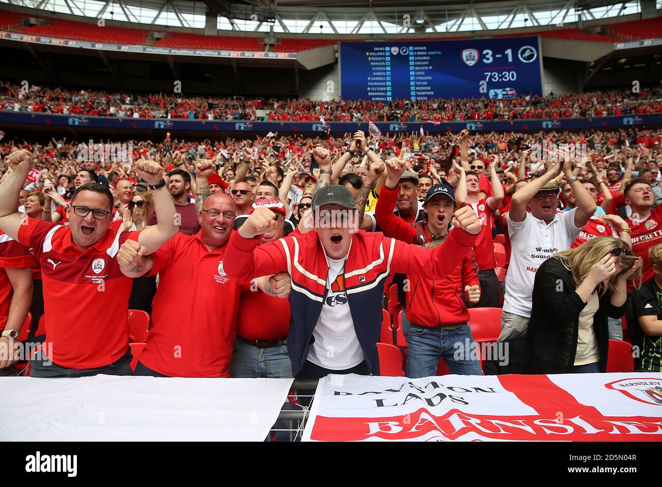 Barnsley fans cheer on their side from the stands Stock Photo - Alamy