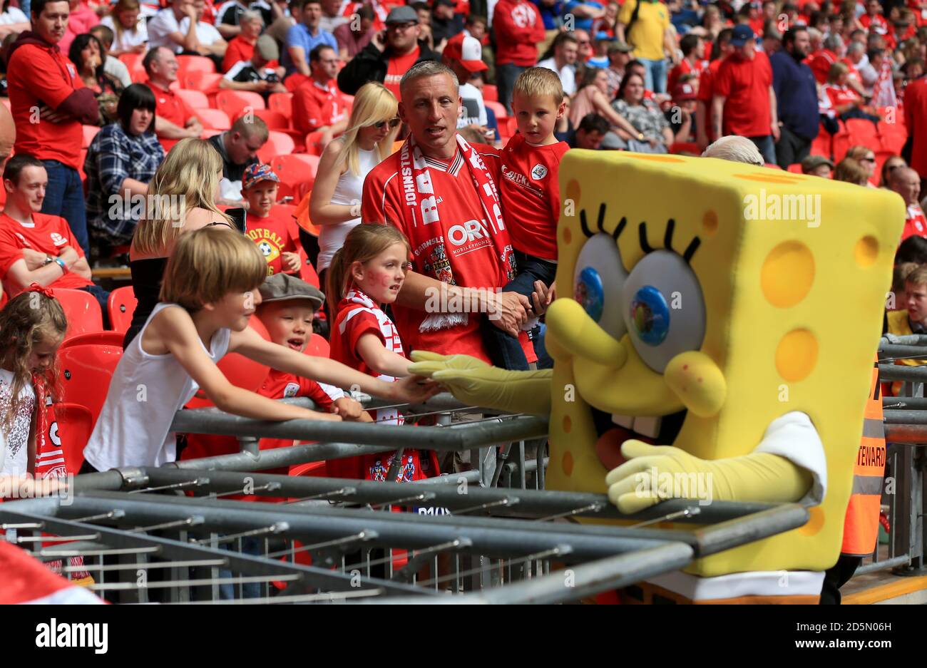 SpongeBob SquarePants meets young fans in the stands Stock Photo - Alamy